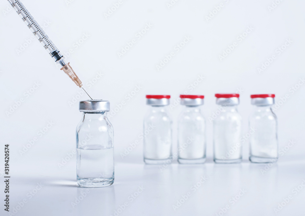 syringe picks up medicine for injection from a vial Stock Photo | Adobe ...