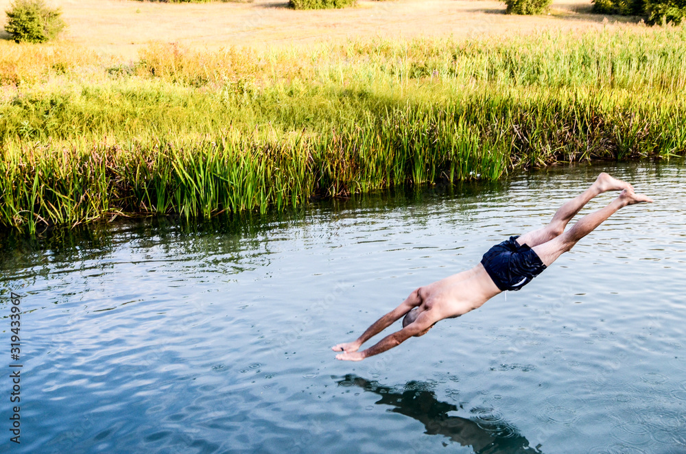 Man Jumping Into Water