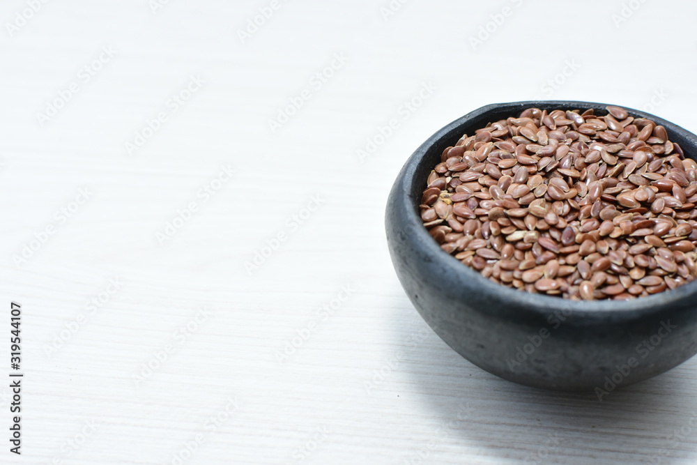 natural flaxseed seeds displayed in containers Stock Photo | Adobe Stock