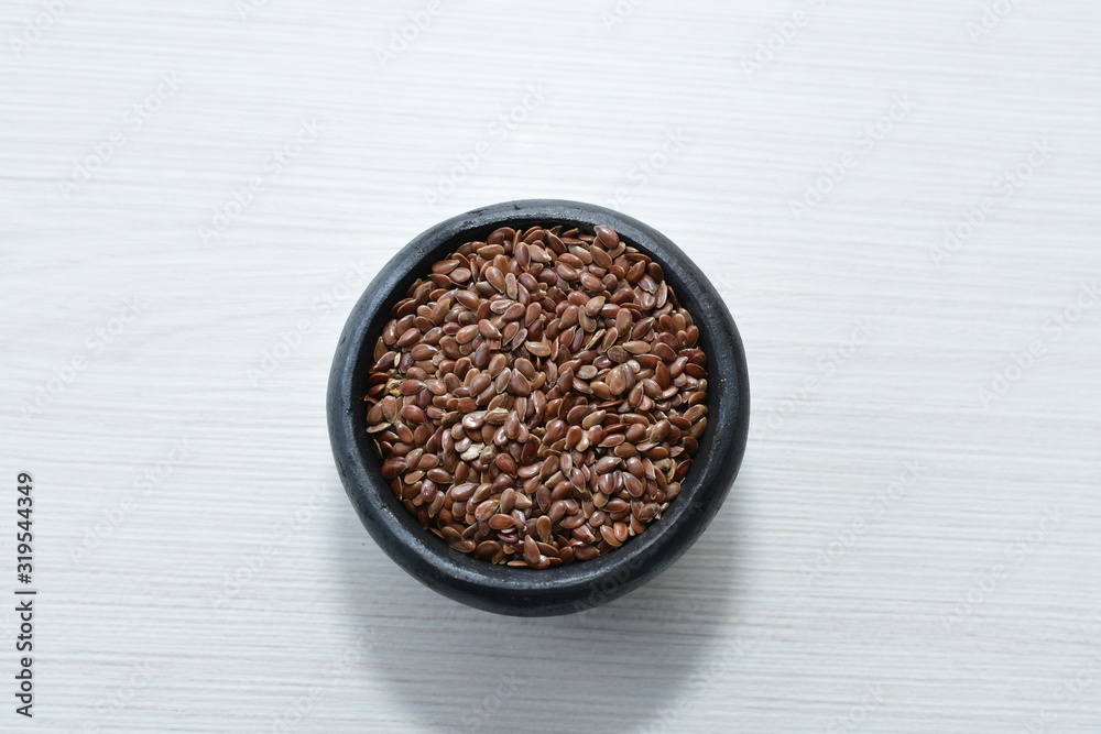 natural flaxseed seeds displayed in containers Stock Photo | Adobe Stock