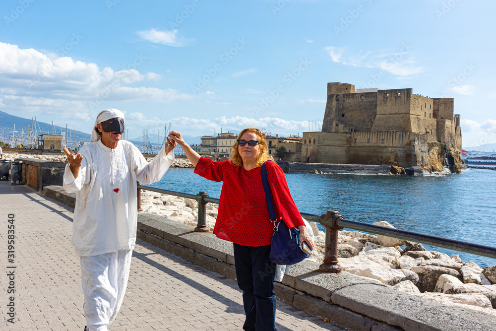 Italy, Naples, 7 October 2019, blonde tourist poses on the waterfront ...