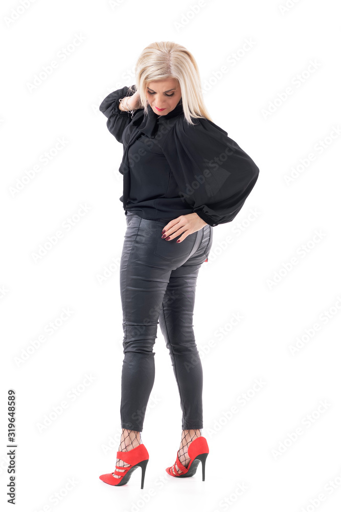 Back view of attractive mid age blonde woman in glamour clothing ...