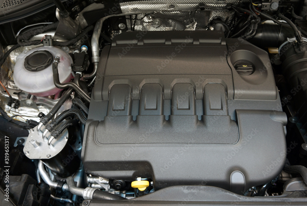 Close-up of the engine of a modern luxury car, the cover protects the ...