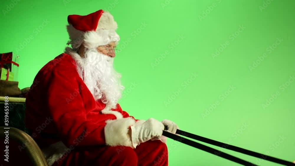Father Christmas flying in his sleigh - Green screen Chroma Key behind ...