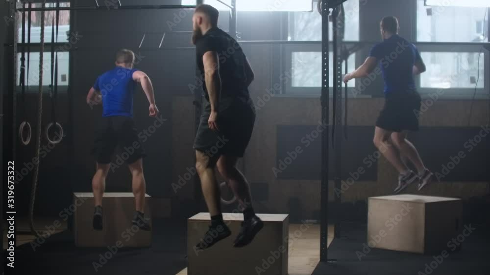 3 fitness man training box jump workout exercise challenge in gym ...