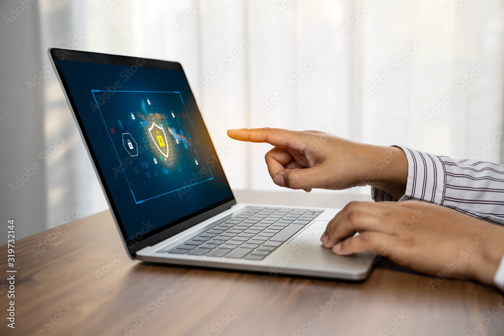 Person using a Laptop Computer with data protection, Cyber security ...