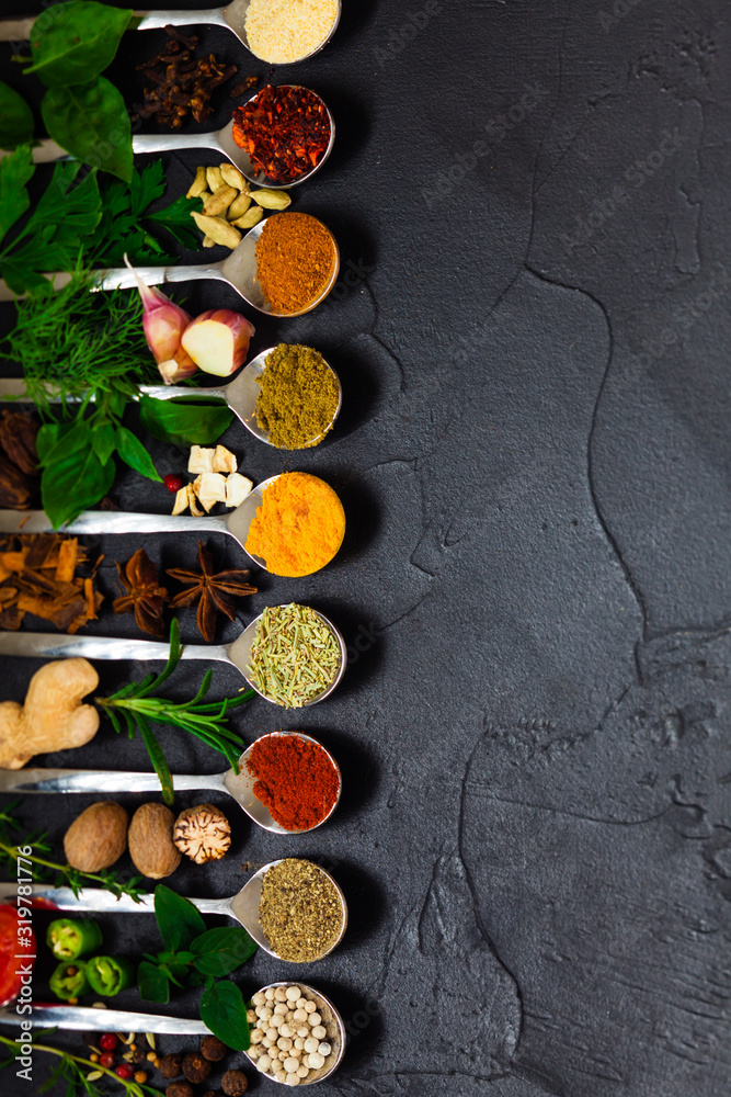 Different kind of spices and herbs on a black background Stock Photo ...