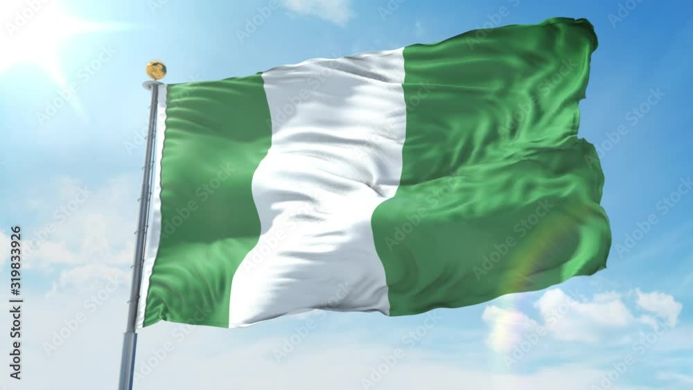Nigeria flag waving in the wind against deep blue sky. National theme ...