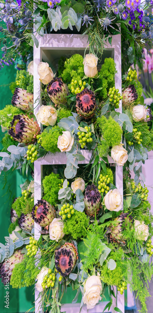 Beautiful vertical background of decorative flowers of roses and exotic ...