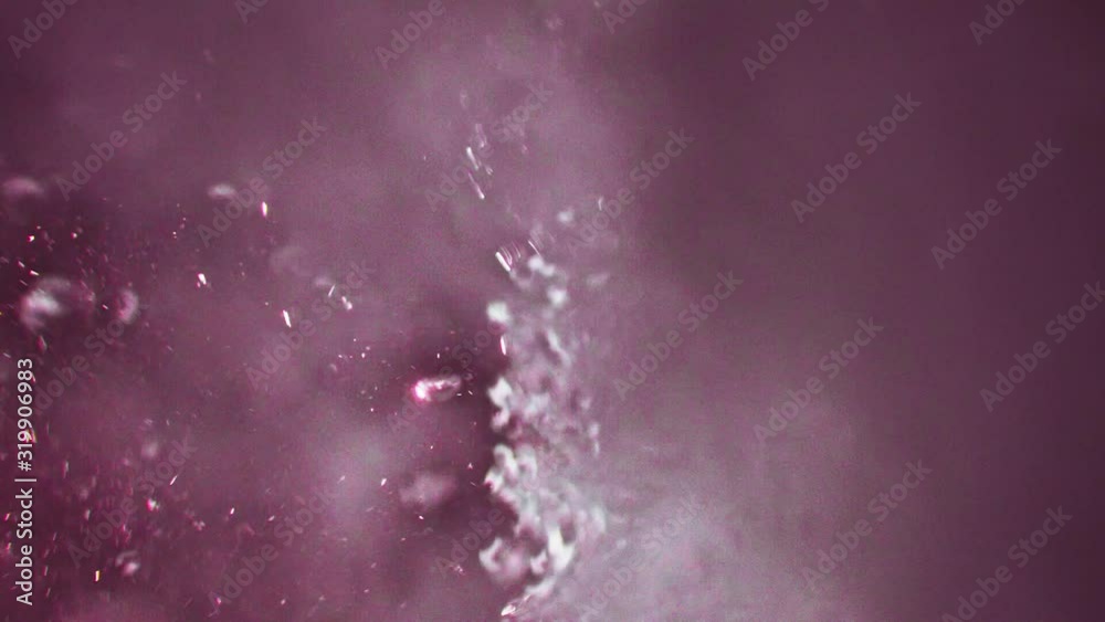 Video of underwater colorful bubbles rising to surface in slow motion 180fps. Close up ...