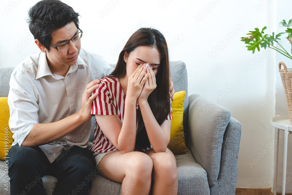 Man consoling his dear ones who are sad. Stock Photo | Adobe Stock