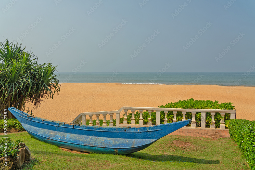 Sri Lanka, Colombo, Mount Lavinia hotel. Ocean sand beach with boat ...