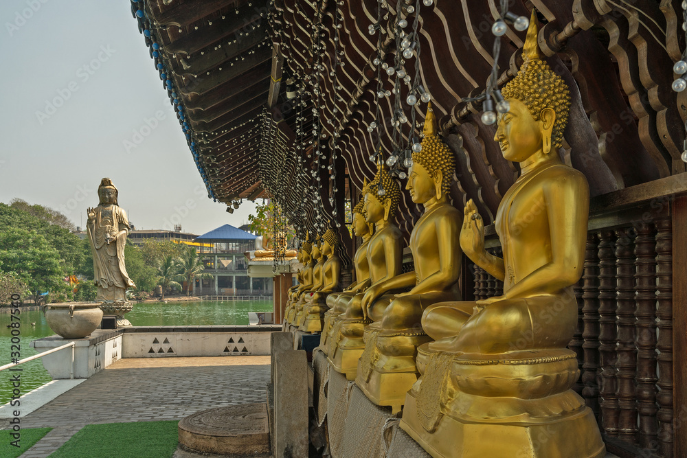 Buddha golden statues in Seema Malaka temple, Colombo city, Sri Lanka ...