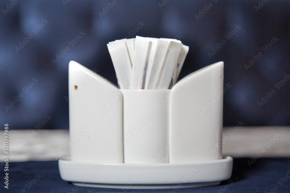Toothpick. Ceramic pepper pot, salt shaker, toothpicks in paper ...