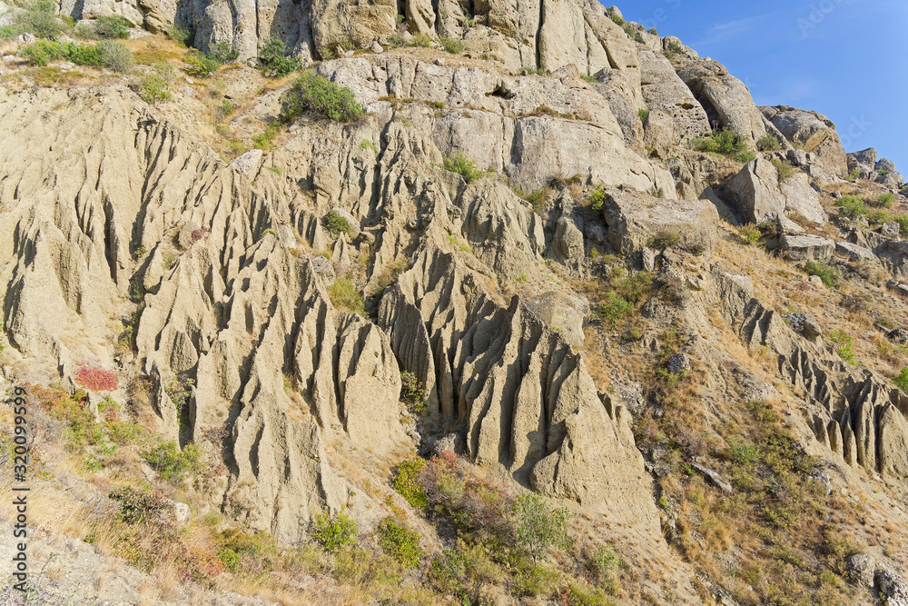 Clay slope with weathering and soil erosion Stock Photo | Adobe Stock