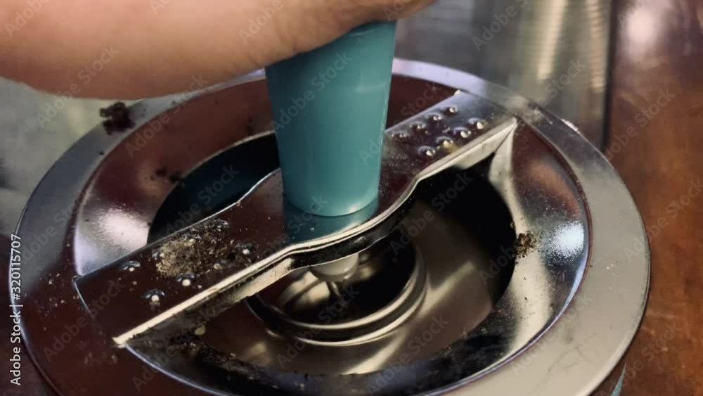 Close up of cigarette ashes and a marijuana joint being ashed into a ...