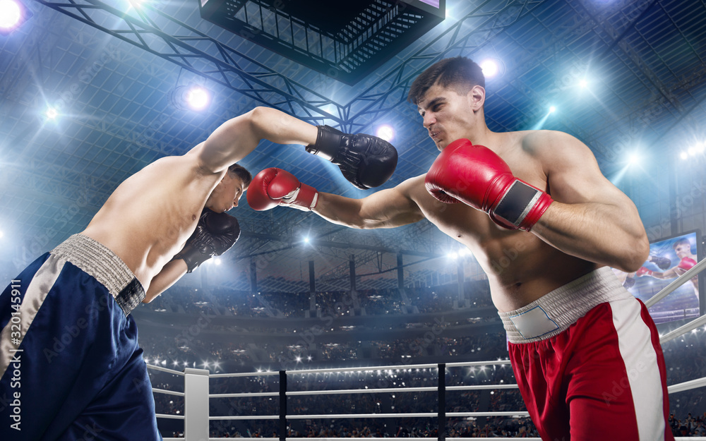 Two boxers are fighting on professional boxing ring. ภาพถ่ายสต็อก ...