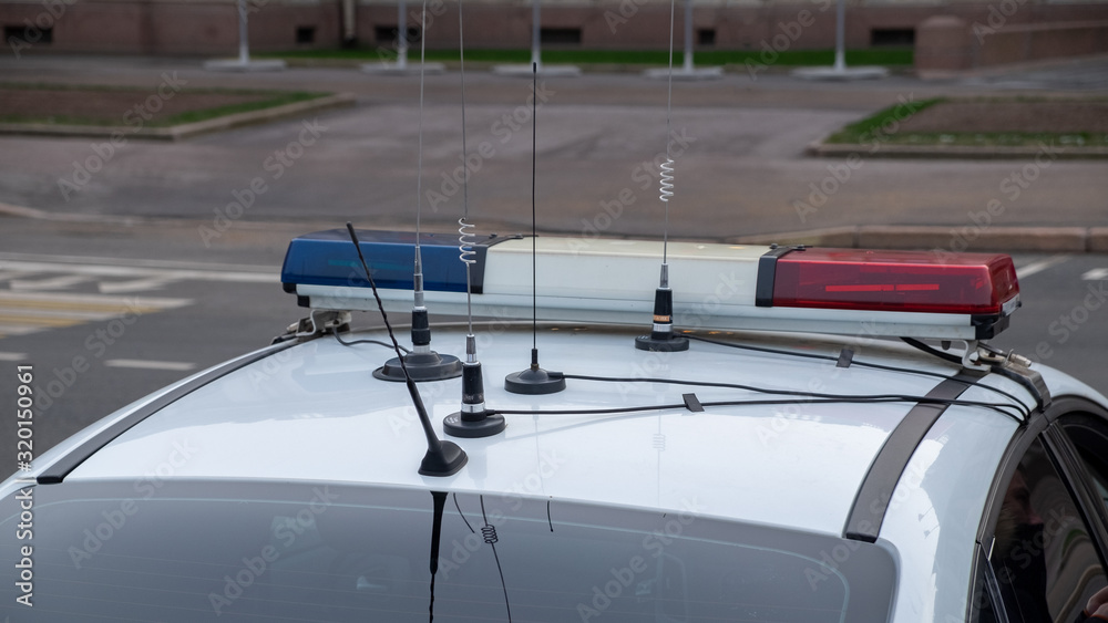 many antennas on the roof of a police car for stable radio ...