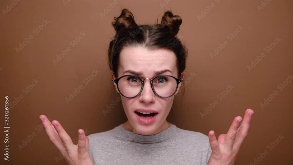 Vidéo Stock Furious woman in eyeglasses feeling anger, annoyed by bad ...