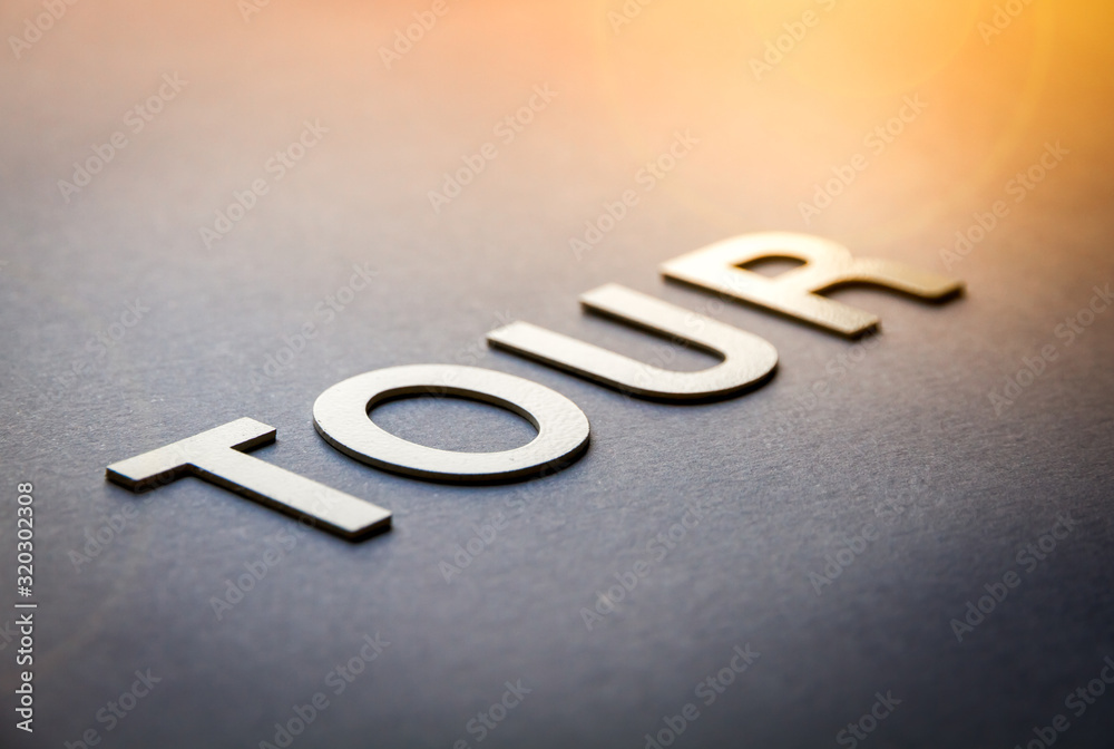 Word tour written with white solid letters Stock Photo | Adobe Stock