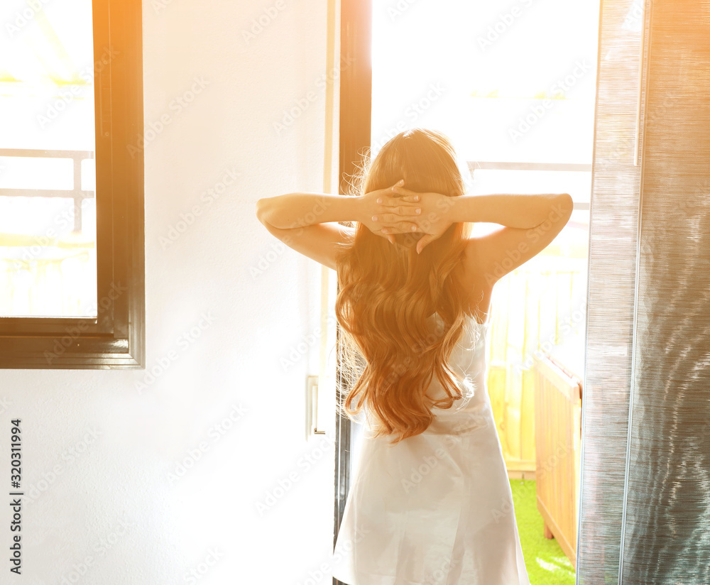 Back view in the morning of Woman Happy and fhreshness standing near ...