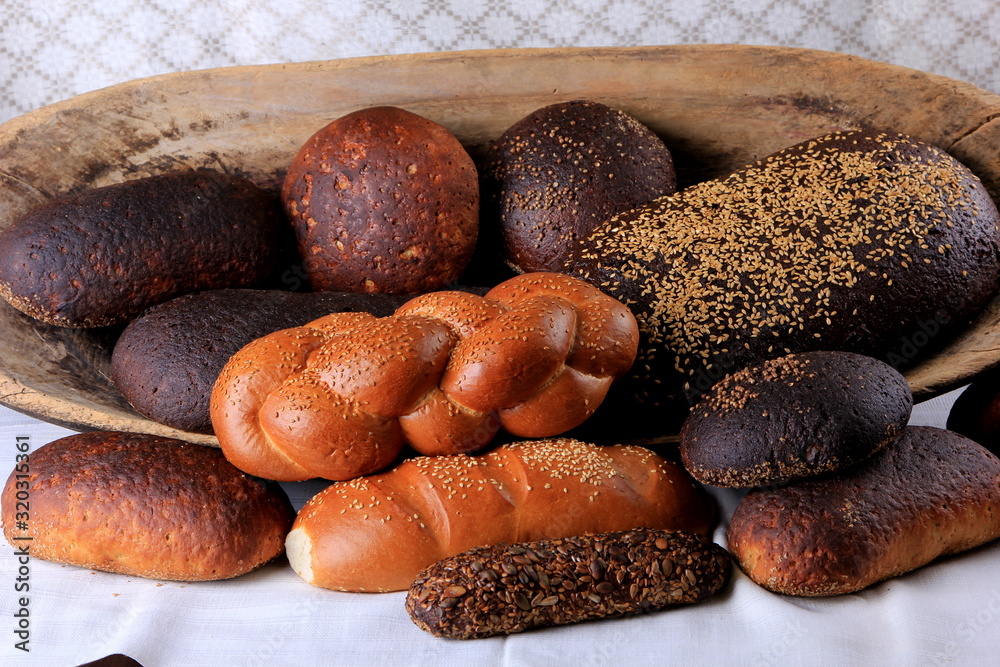 Fresh collection of bread and wheat on the table. Collection of ...