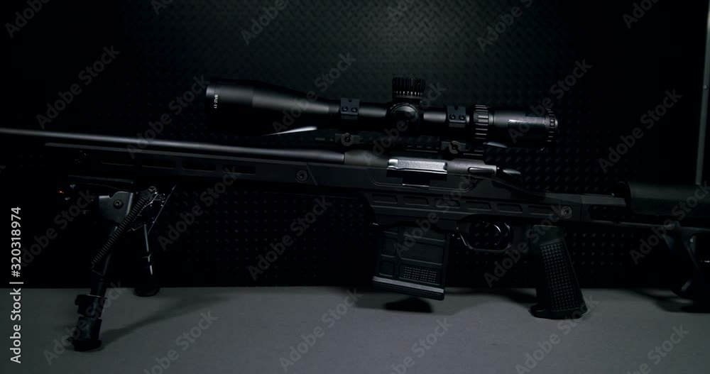 black Sniper Rifle with high powered Scope and ten round Magazine on ...
