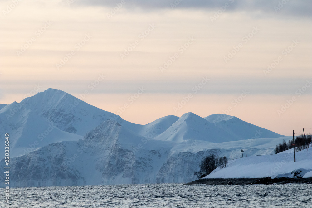 Arctic landscape in winter with snowy mountains and sea. Norwegian ...