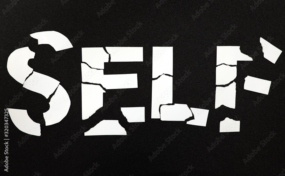 Fragmented self paper cutout in black background. Mental health, broken ...
