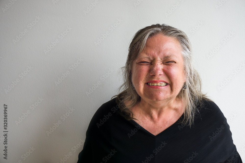 Old woman disgusted face expression. Elder modern woman closed her eyes ...