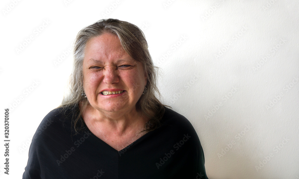 Old woman disgusted face expression. Elder modern woman closed her eyes ...
