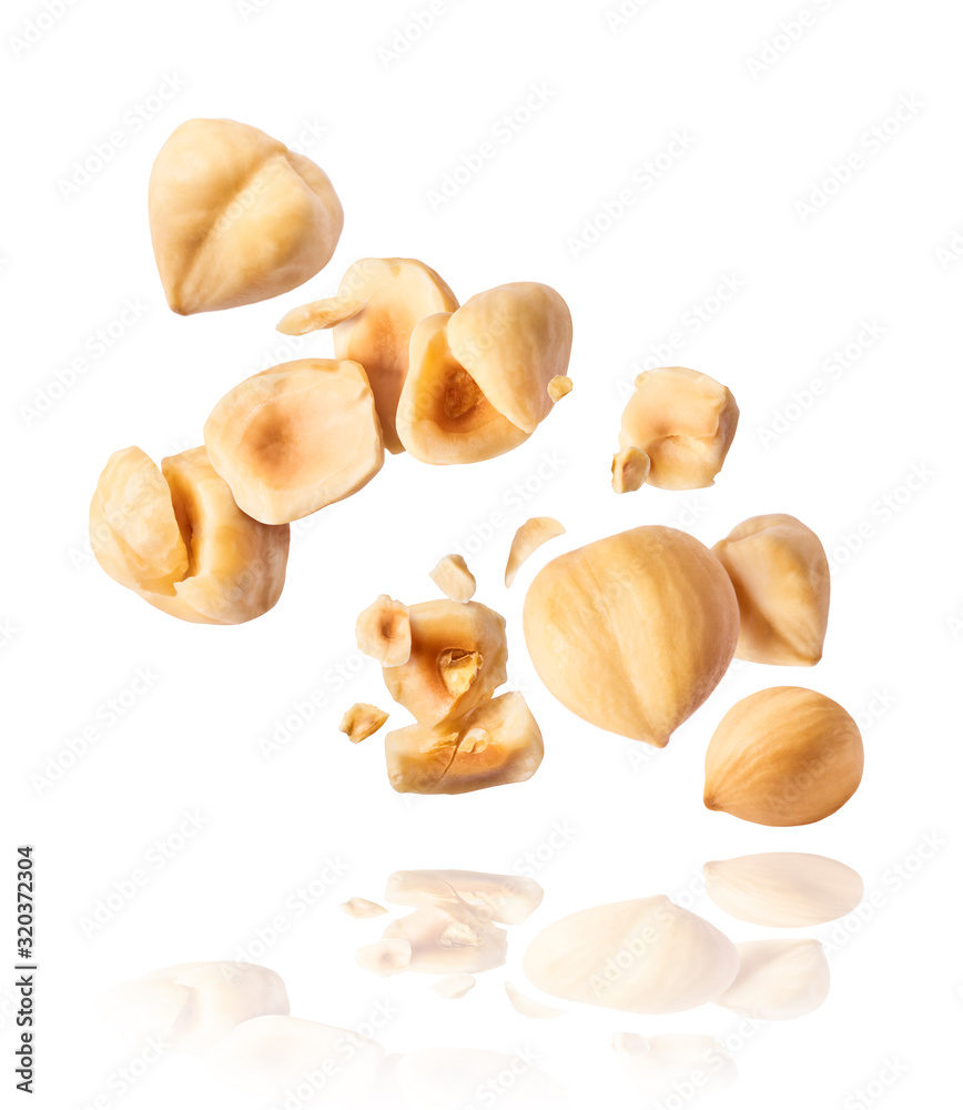 Hazelnuts crushed into pieces, frozen in the air. Stock Photo | Adobe Stock Hazelnuts crushed into pieces, frozen in the air. Stock Photo | Adobe Stock