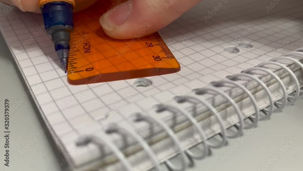 Draw lines with a ruler on a piece of paper in a notepad Stock ビデオ ...