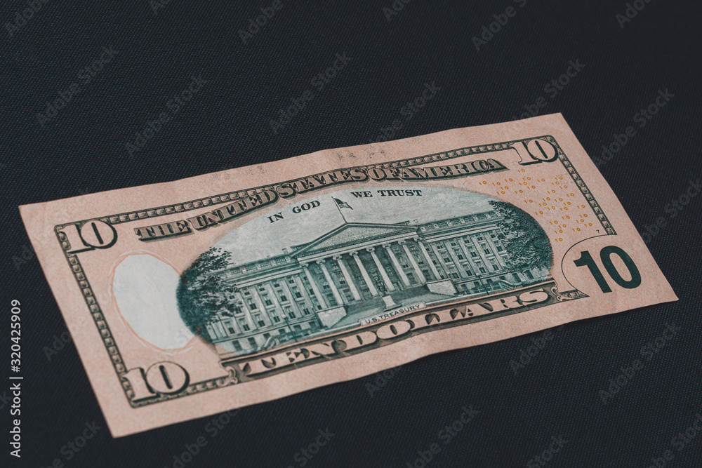 Ten Americandollars are on the back of a black background. Stock Photo ...