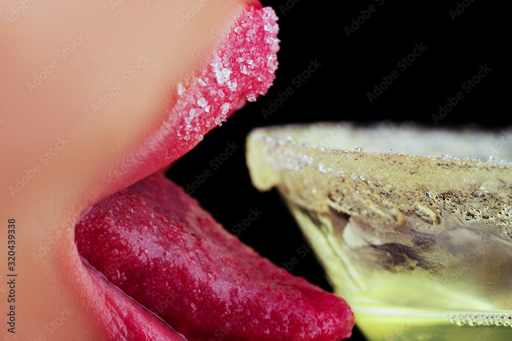 Cocktail party. Sugar lips with martini cocktail. Sexy lips lick sugar ...