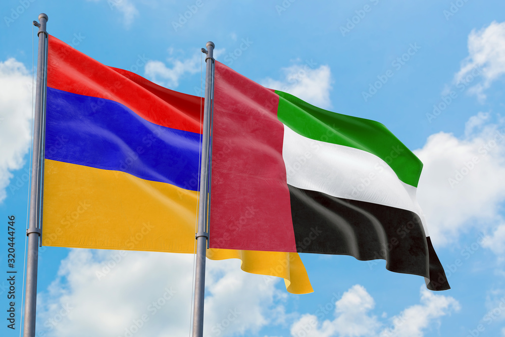 United Arab Emirates and Armenia flags waving in the wind against white ...