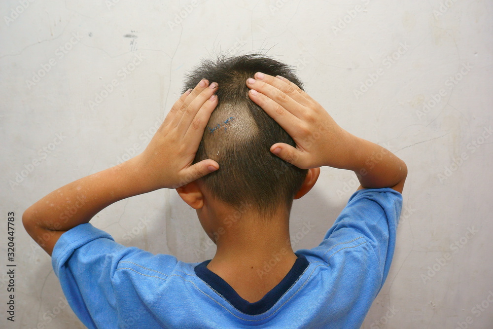 there was a boy with a scratch on the head, who had just been sutured ...