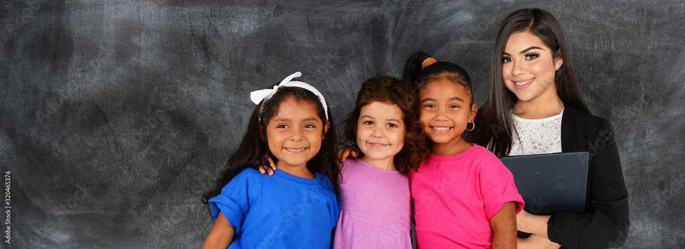 Teacher With Hispanic Students At School Stock Photo | Adobe Stock