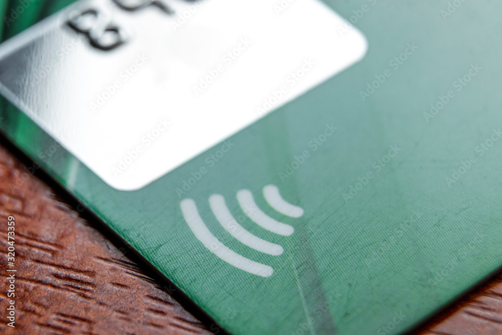 Contactless credit card sign close-up, soft focus. New technologies ...