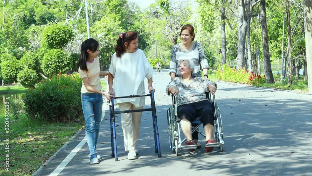 Happy asian family,senior woman, disabled grandmother with walker and ...