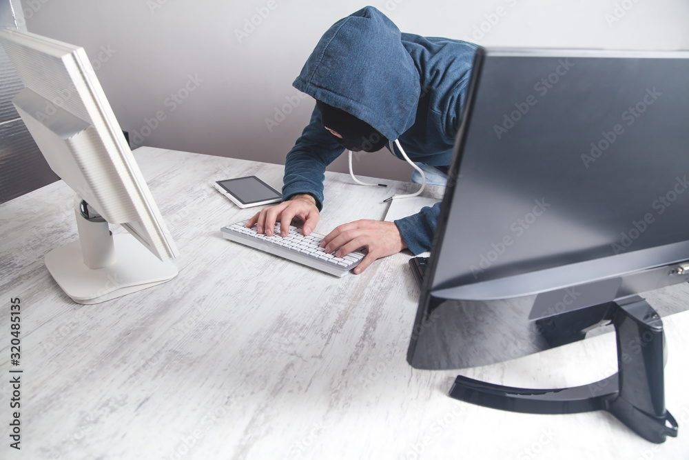 Hacker stealing information from the office computer. Hacking, Criminal ...