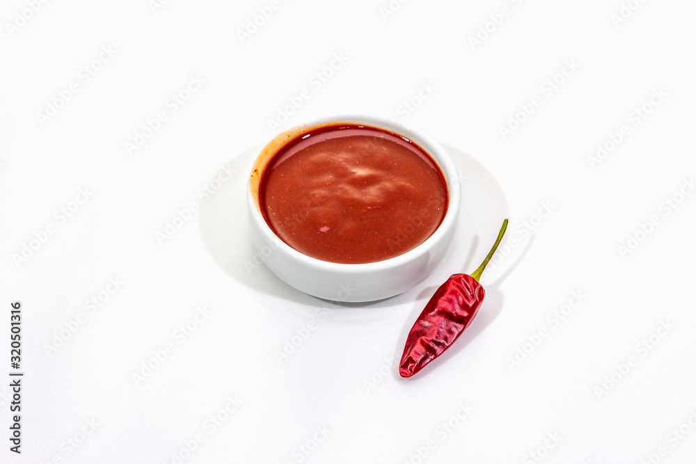 Spicy chili sauce in bowl isolated on white background. Different ...