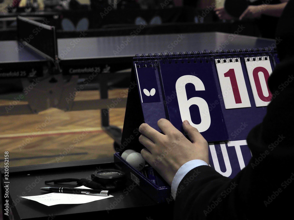 Table tennis referee with an abacus Photos | Adobe Stock