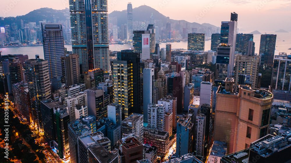 Aerial top view of downtown district buildings in night city light ...