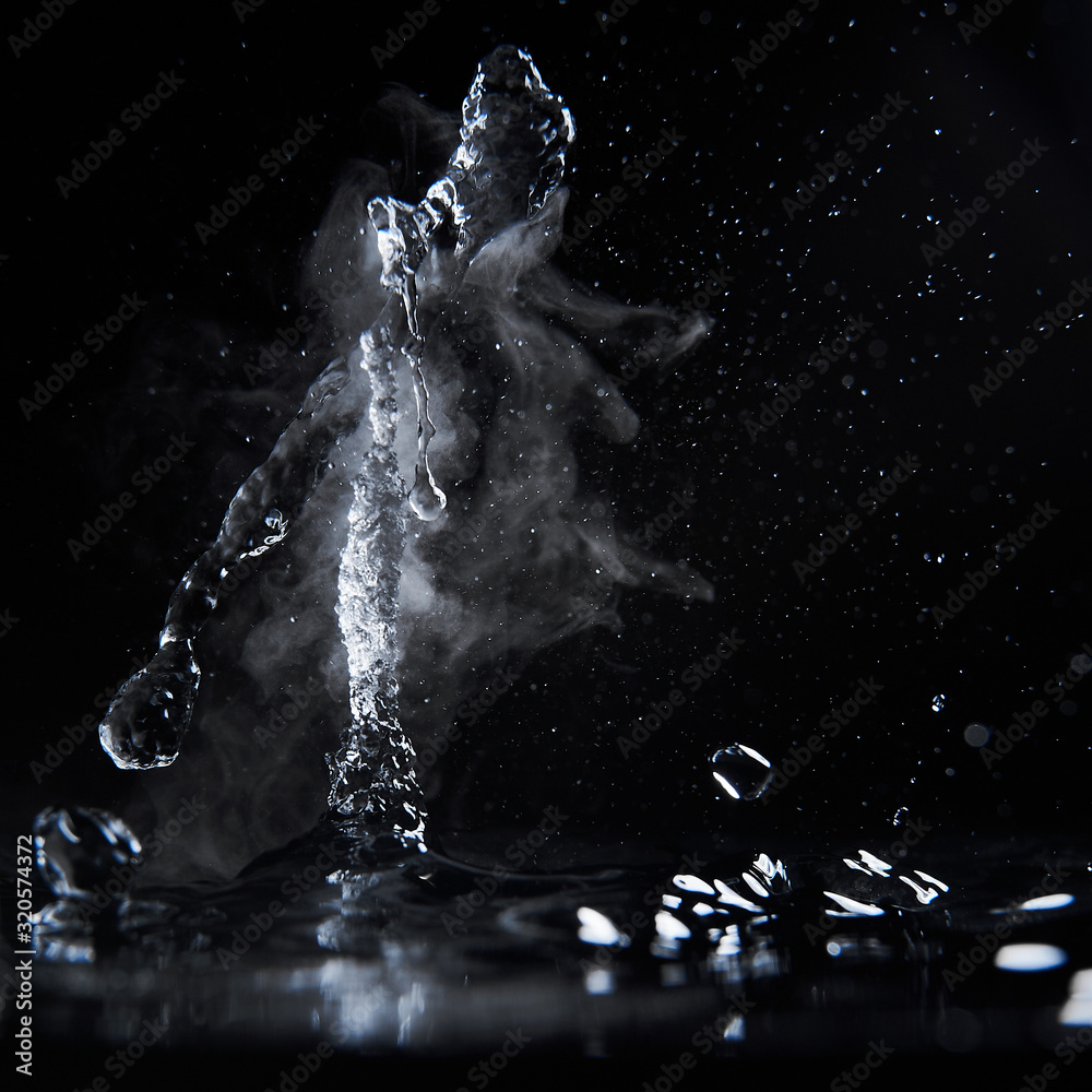 Boiling water splash with steam on black background closeup Stock Photo ...