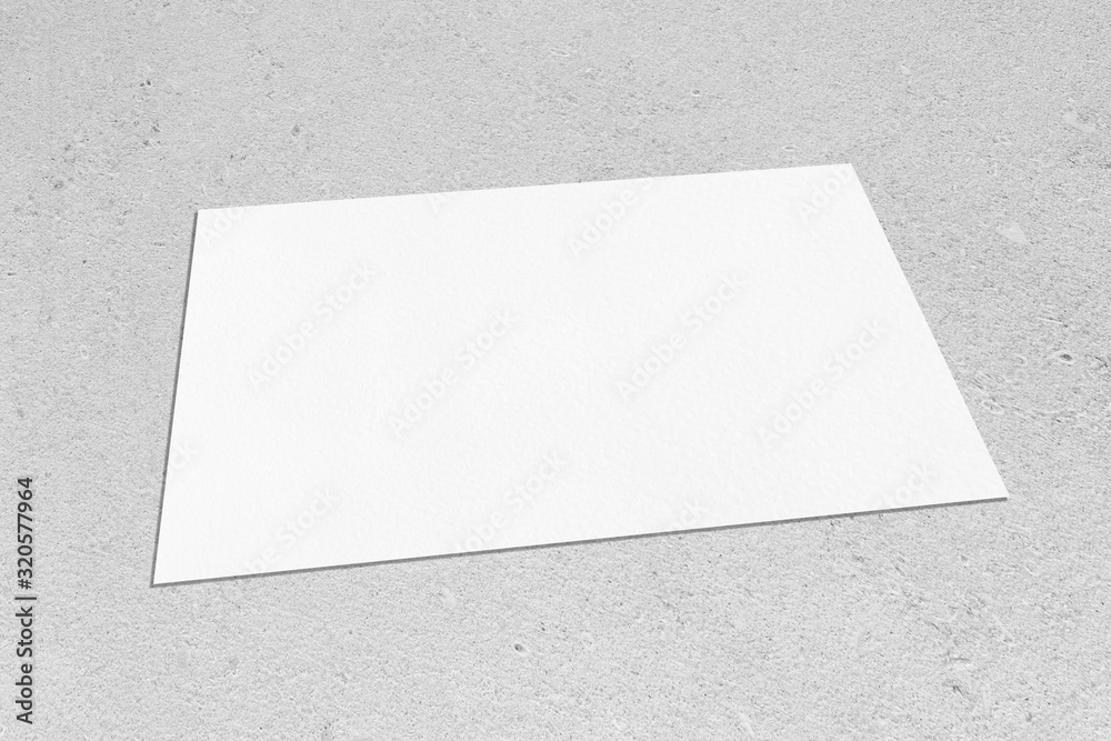 Closeup of empty white rectangle horizontal poster mockup lying ...