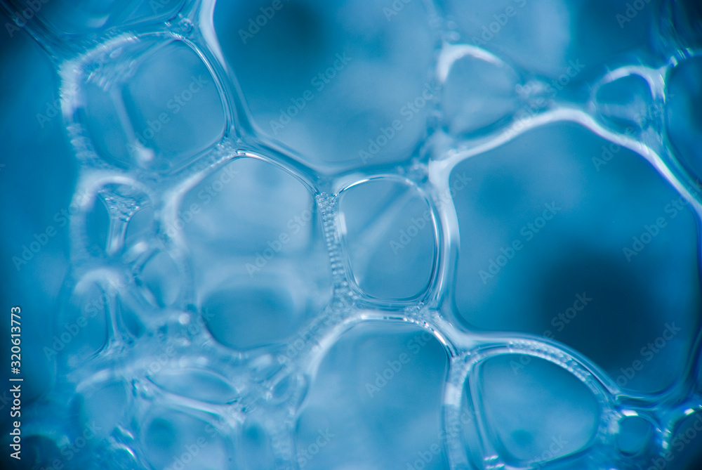 Micrograph of foamy chemical fluid. The chain of compounds of ...