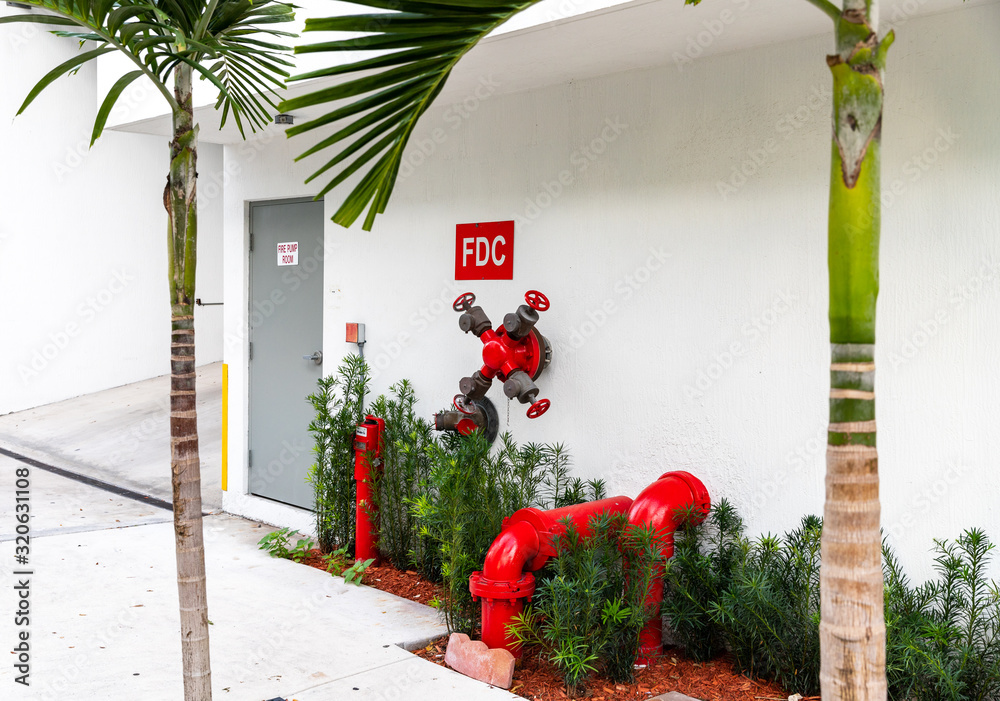 Fire Department Connection on the outside of a commercial building, for ...