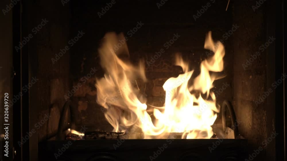 A look at the beautiful fire inside the fireplace behind the glass ...