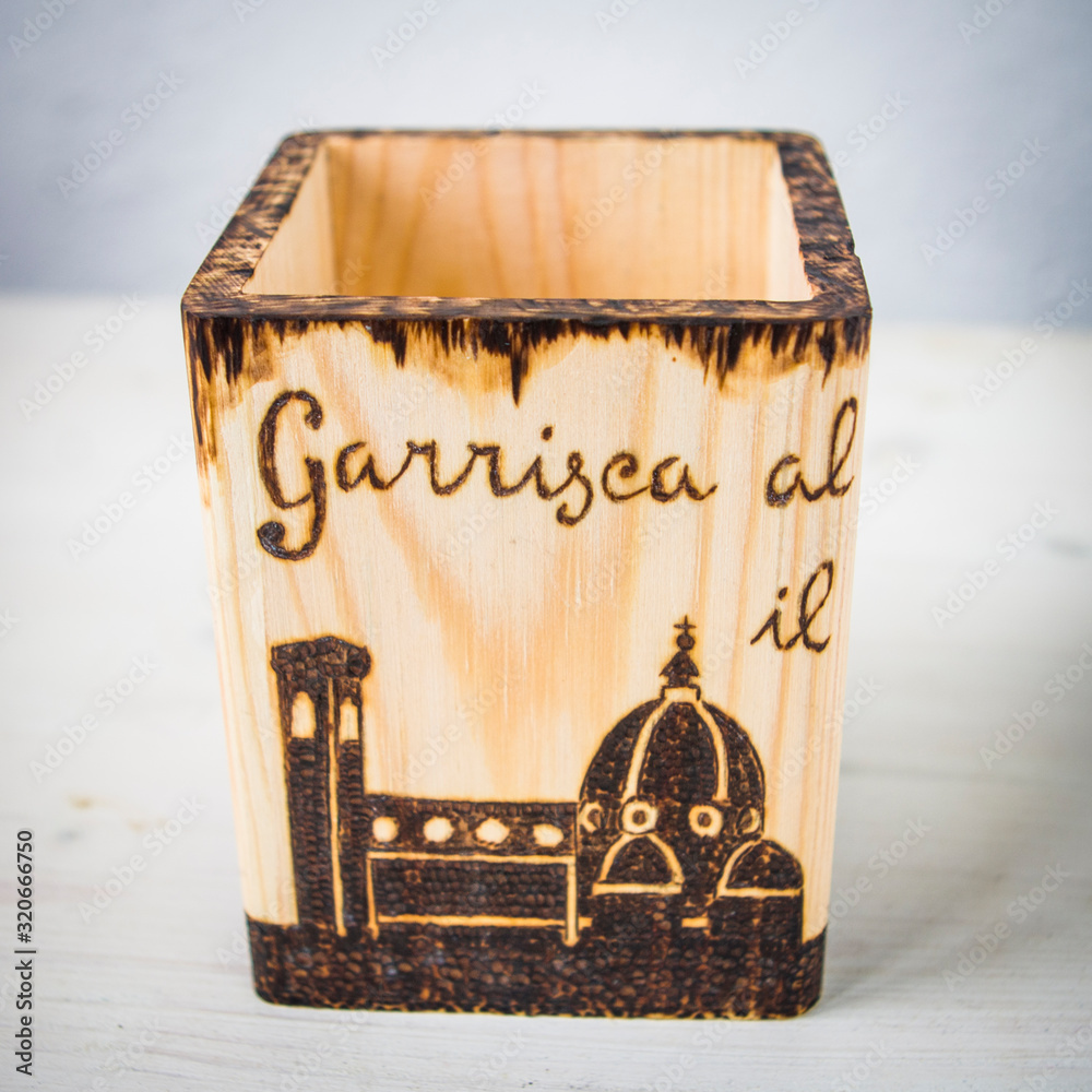 the ancient art of pyrography, wood and fire, the symbols of the city ...